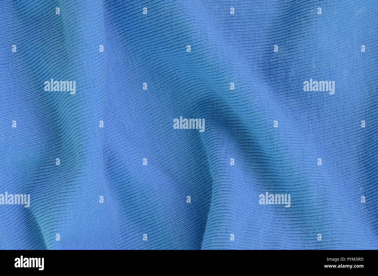 The texture of the fabric in blue color. Material for making shirts and ...
