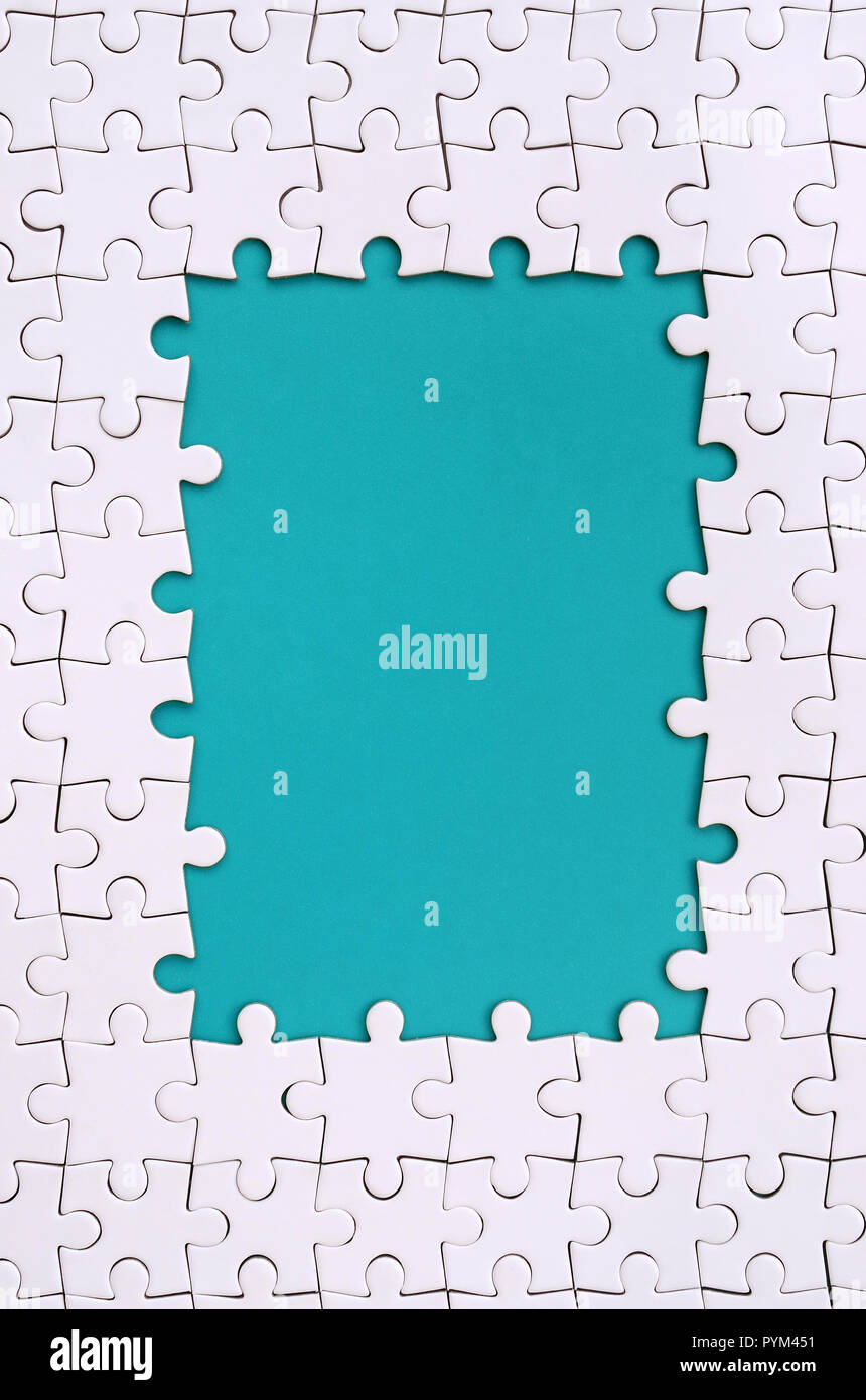 Framing in the form of a rectangle, made of a white jigsaw puzzle ...