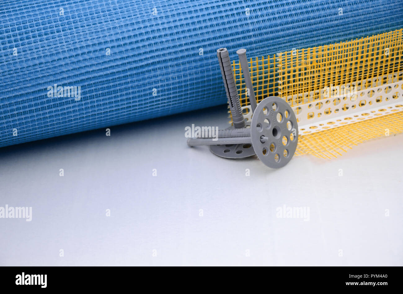 A set of construction items for the insulation of walls. Plastic dowels ...