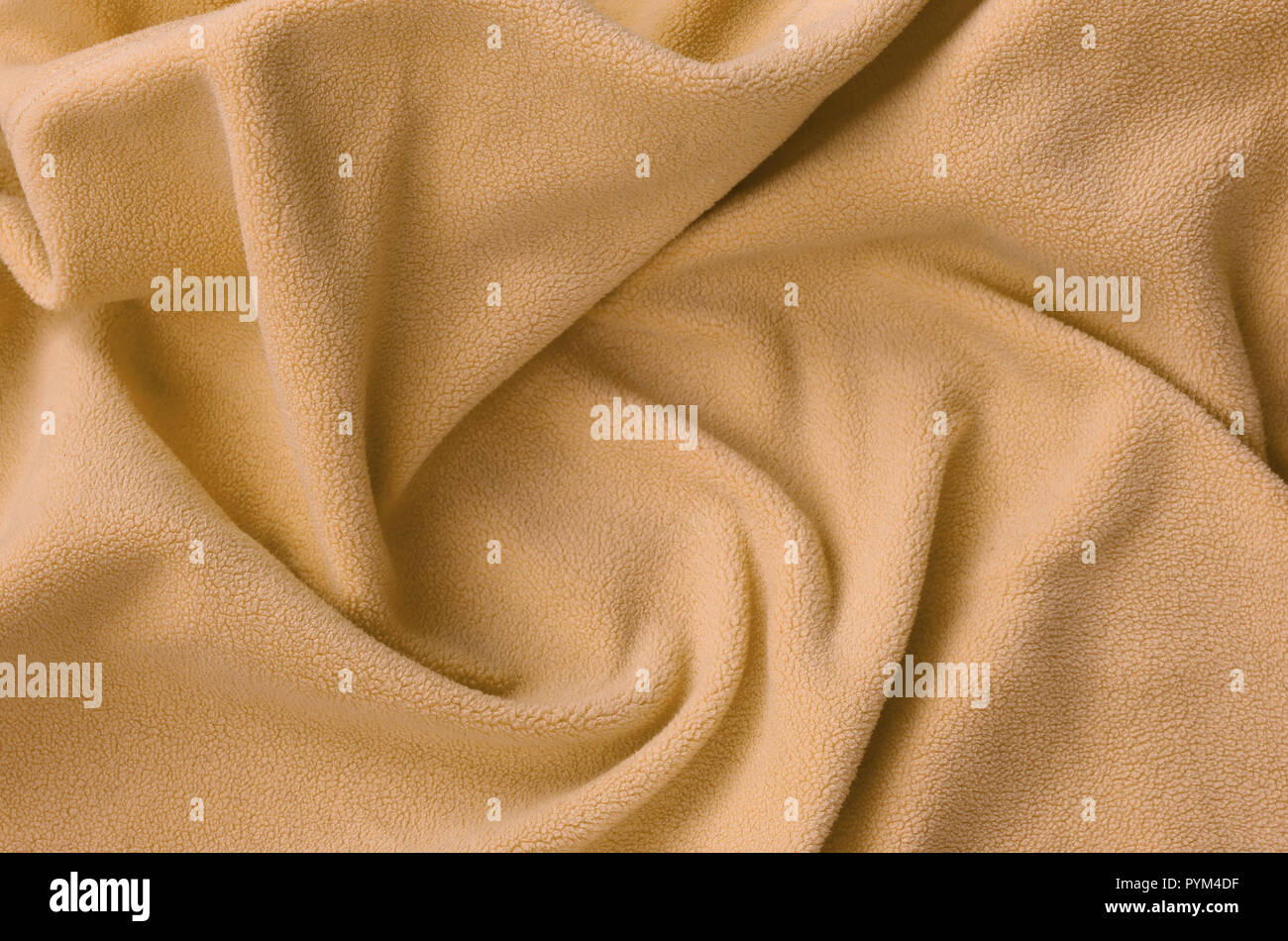 The blanket of furry orange fleece fabric. A background of light orange ...