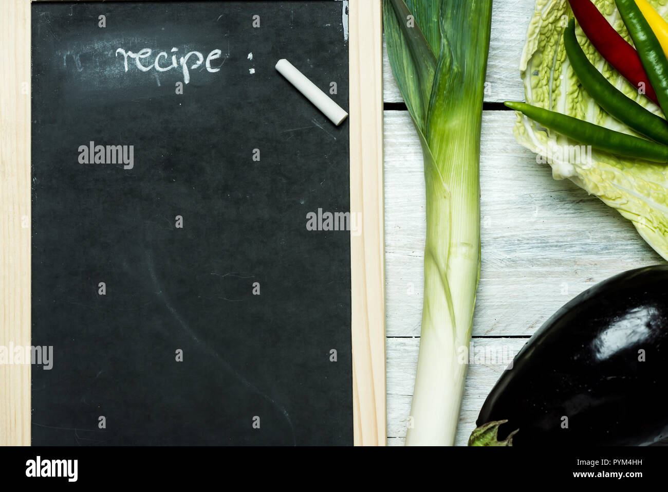 blackboard with the word "recipe" on white, rustic wooden background ...
