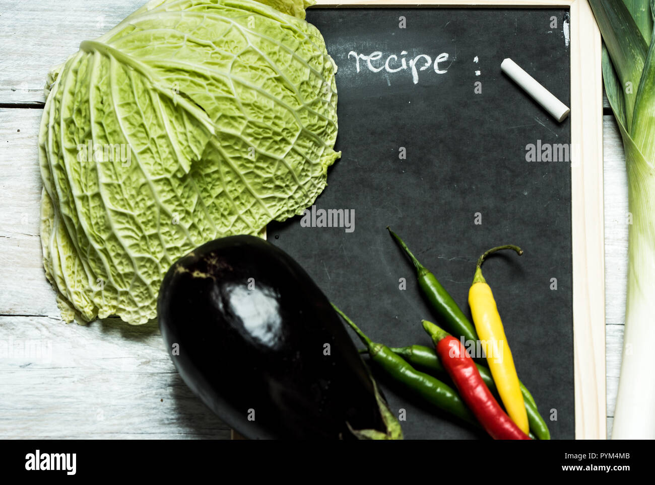 blackboard with the word "recipe" on white, rustic wooden background ...