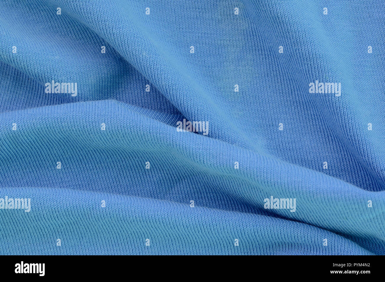 The texture of the fabric in blue color. Material for making shirts and ...