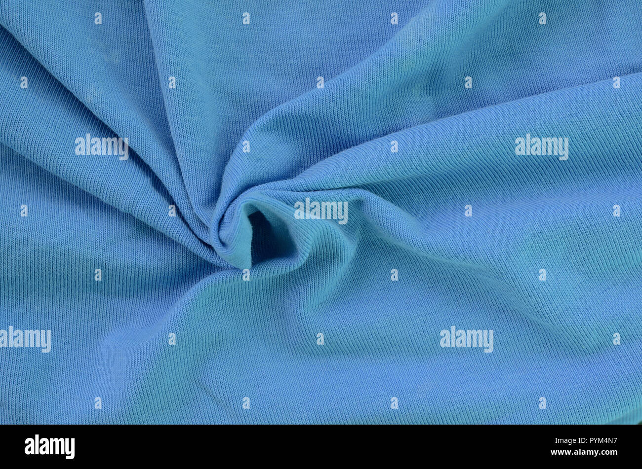 The texture of the fabric in blue color. Material for making shirts and ...