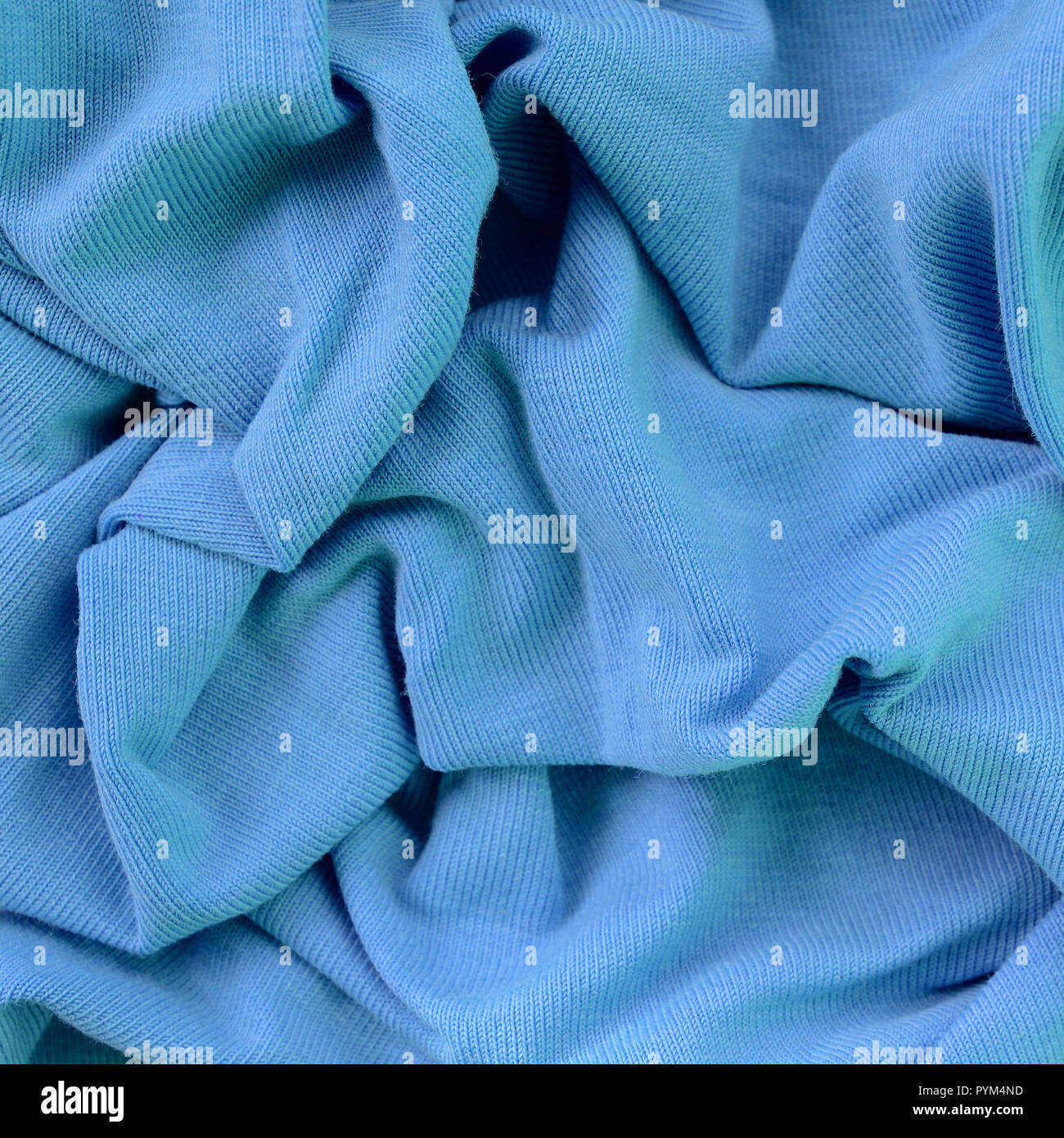 The texture of the fabric in blue color. Material for making shirts and ...