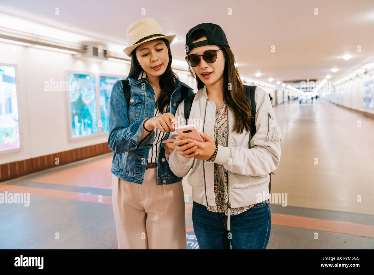 local lady telling the female traveler the right direction. showing the ...