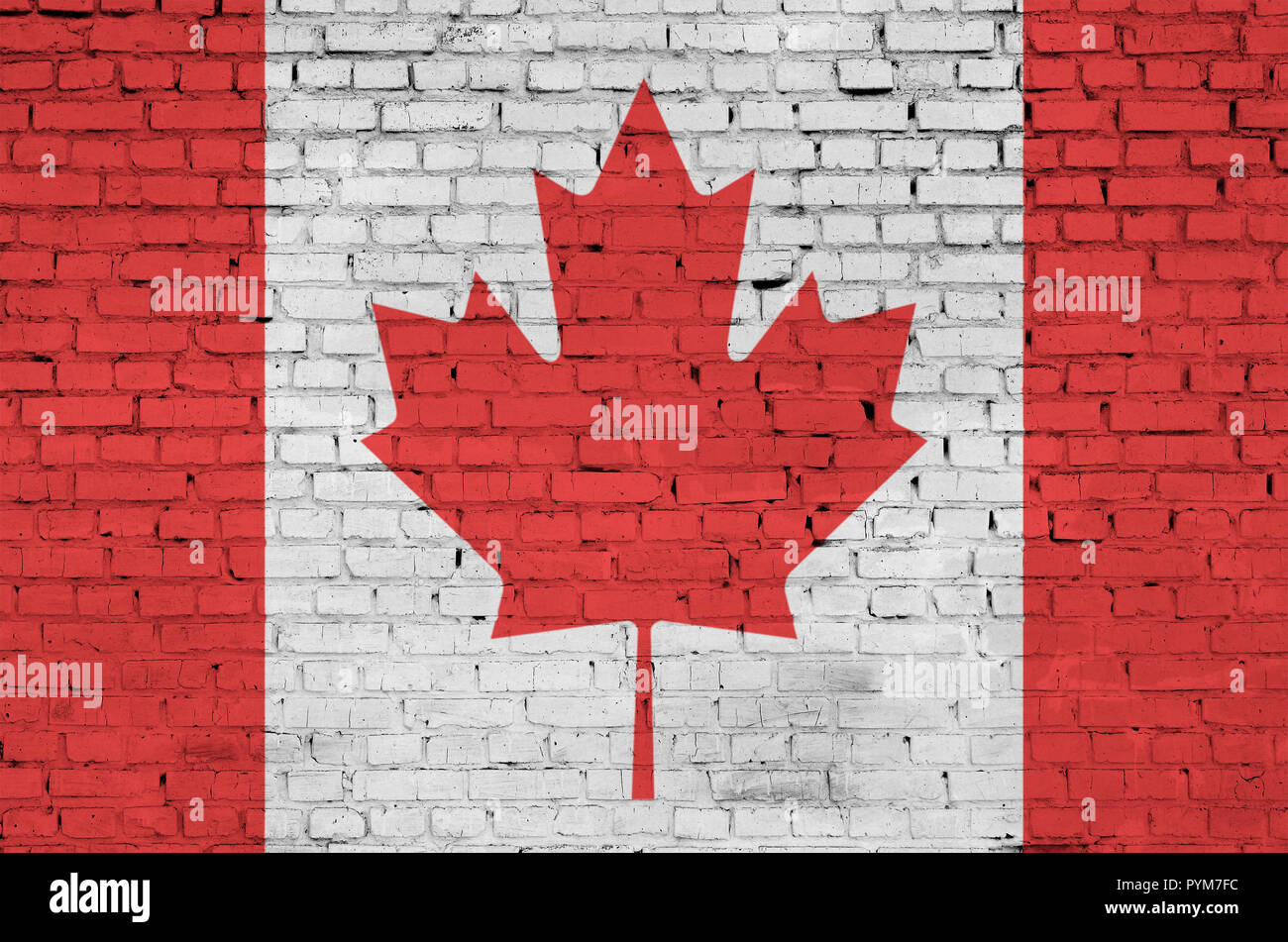 Canada flag is painted onto an old brick wall Stock Photo - Alamy