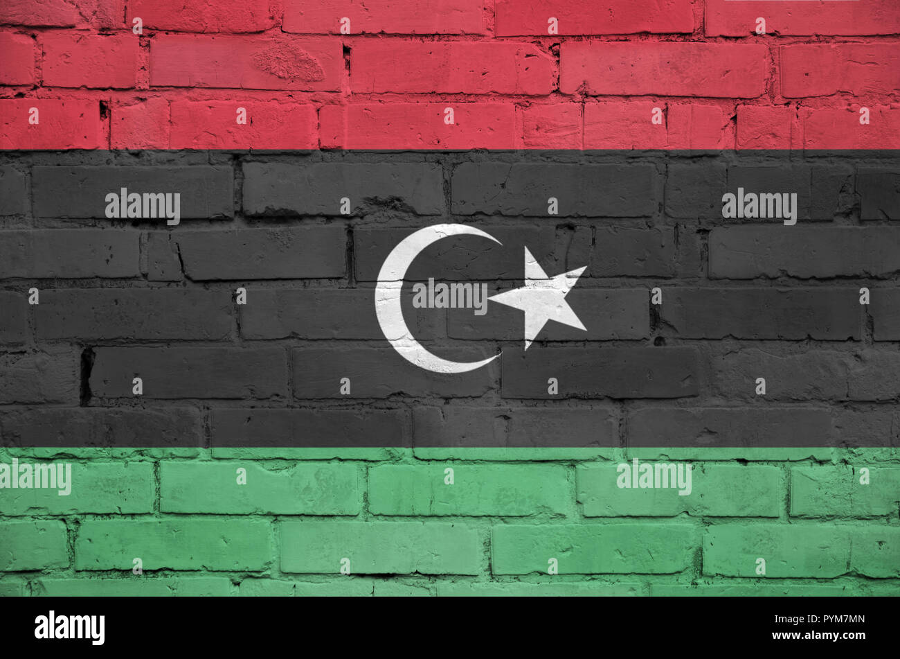 Libya flag is painted onto an old brick wall Stock Photo - Alamy