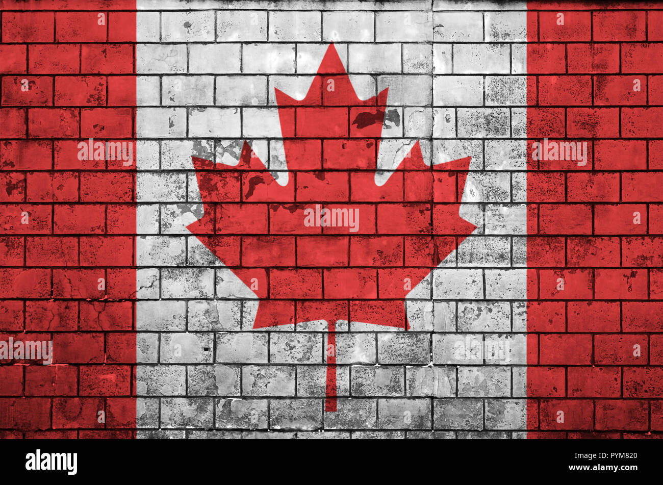 Canada flag is painted onto an old brick wall Stock Photo - Alamy