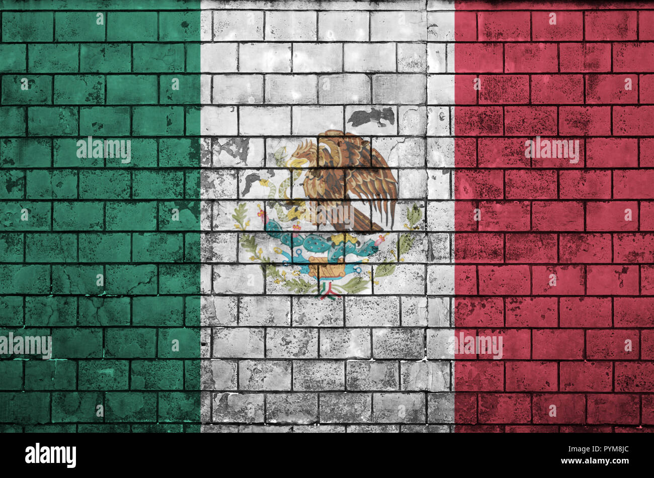 Mexico flag is painted onto an old brick wall Stock Photo - Alamy