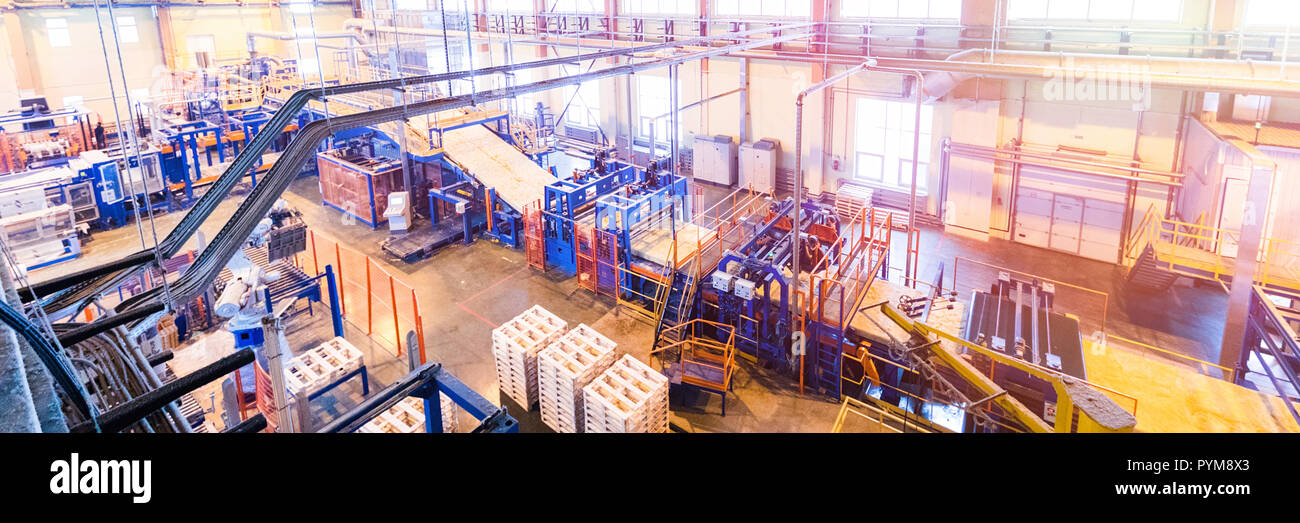 Fiberglass production industry equipment at manufacture background ...