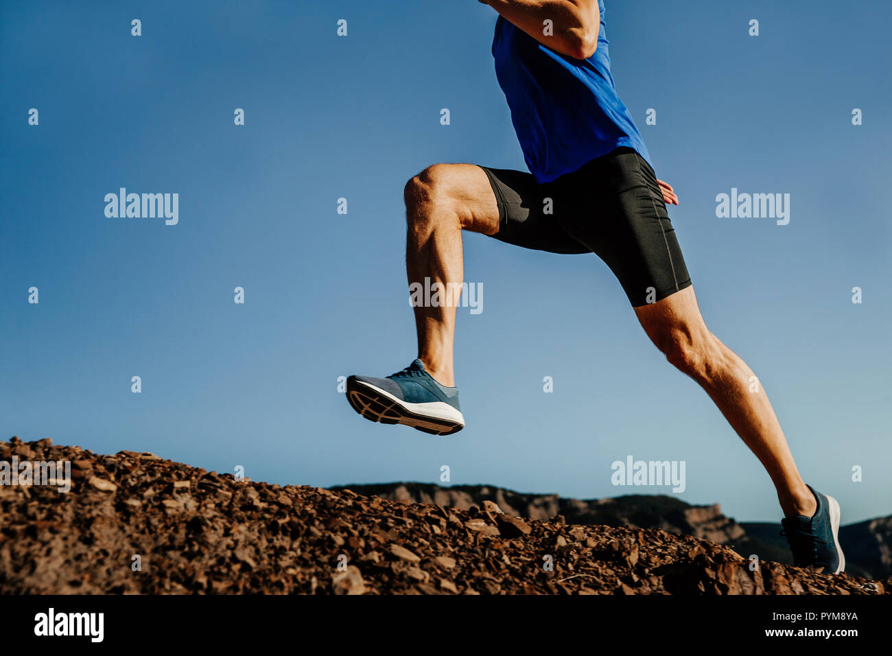 legs athlete runner dynamic running on mountain trail Stock Photo - Alamy
