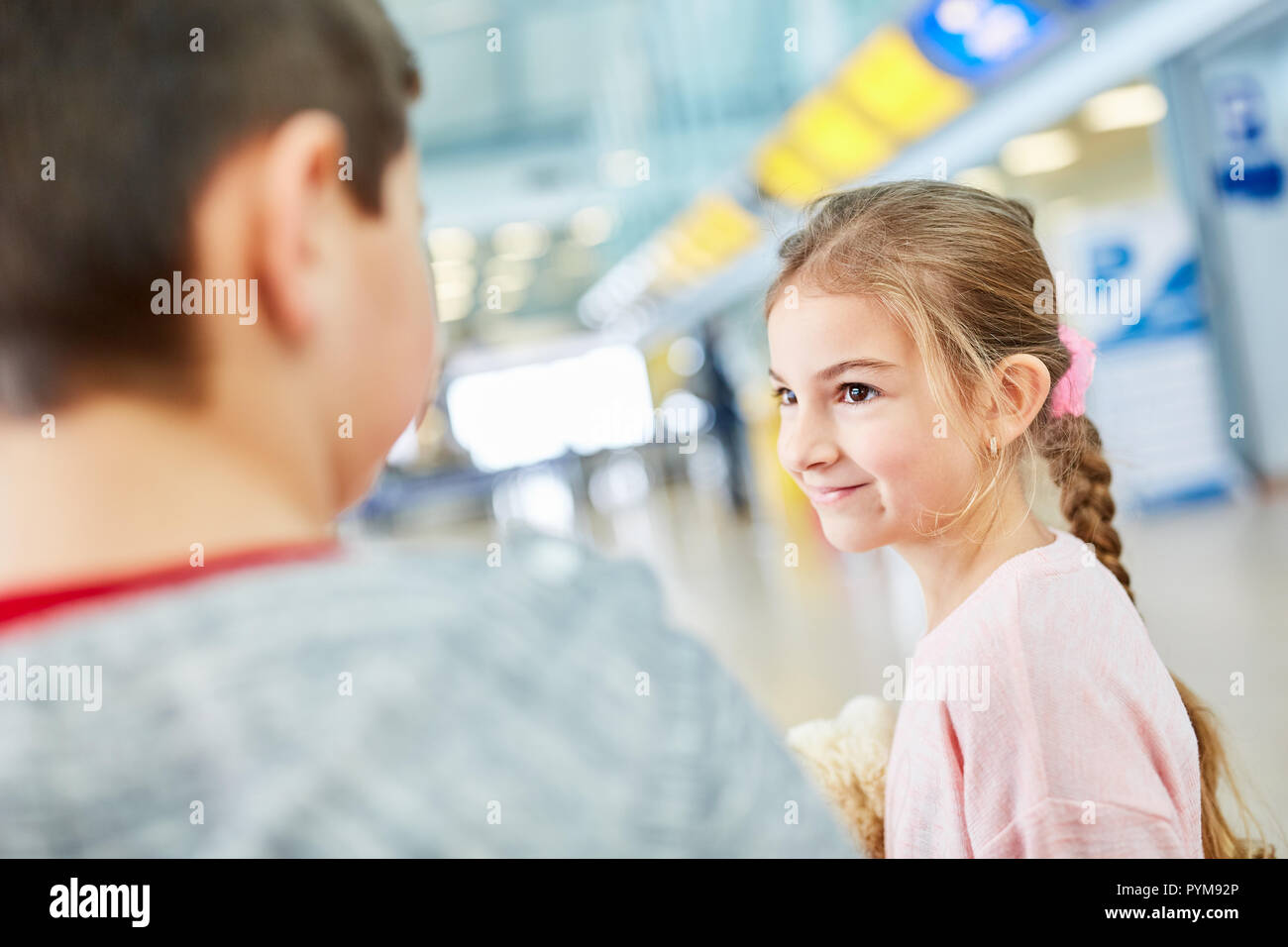 Children as siblings or friends in the airport terminal travel together ...