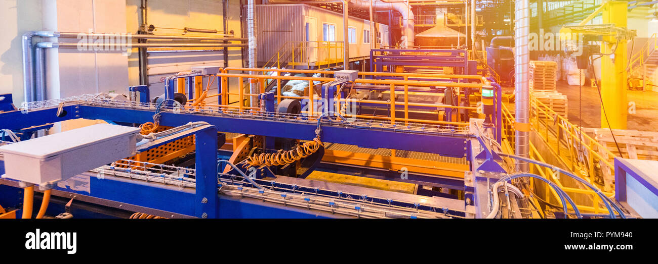 Fiberglass production industry equipment at manufacture background ...