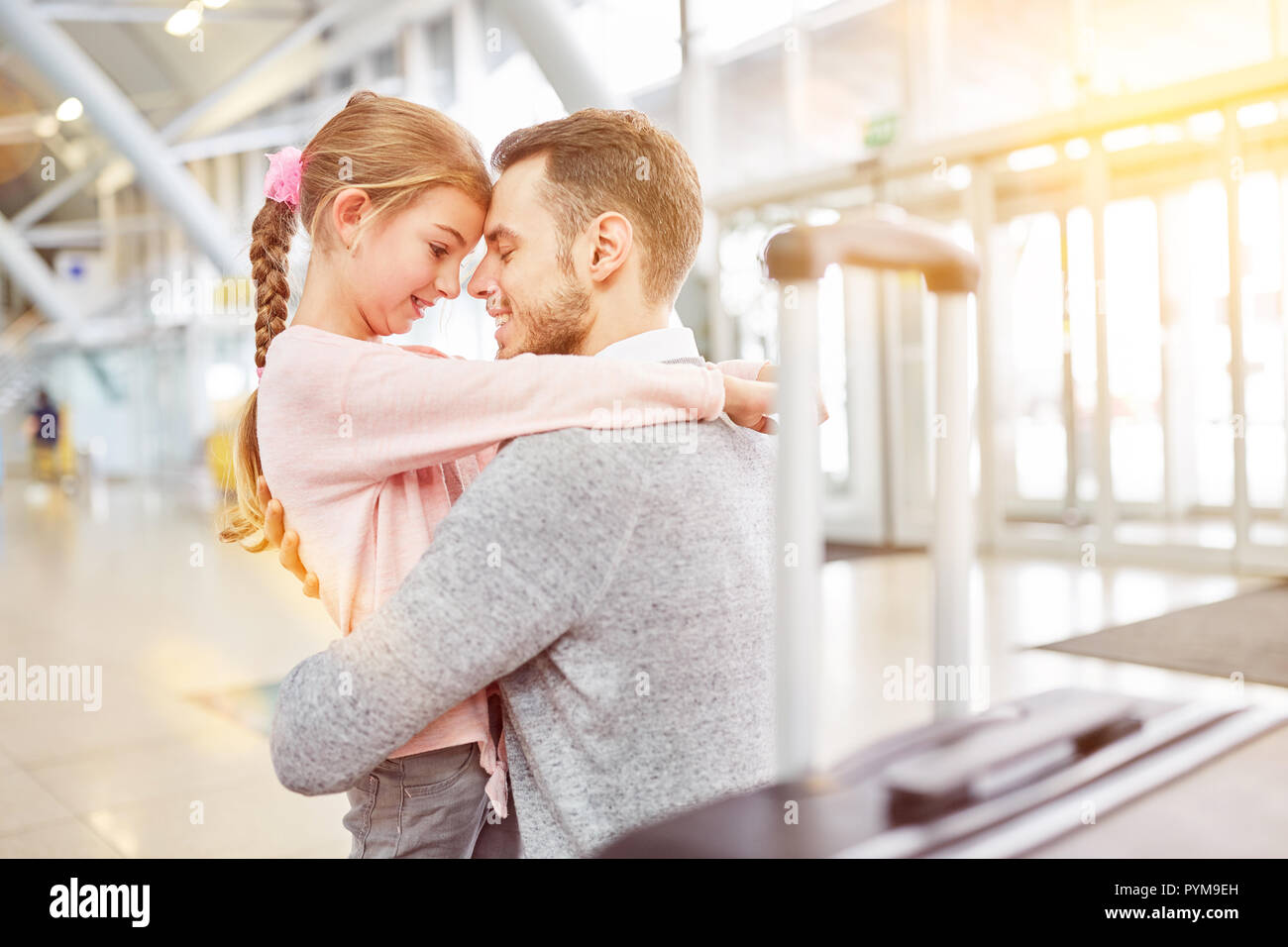 Daughter saying goodbye to father at the airport before a trip Stock ...