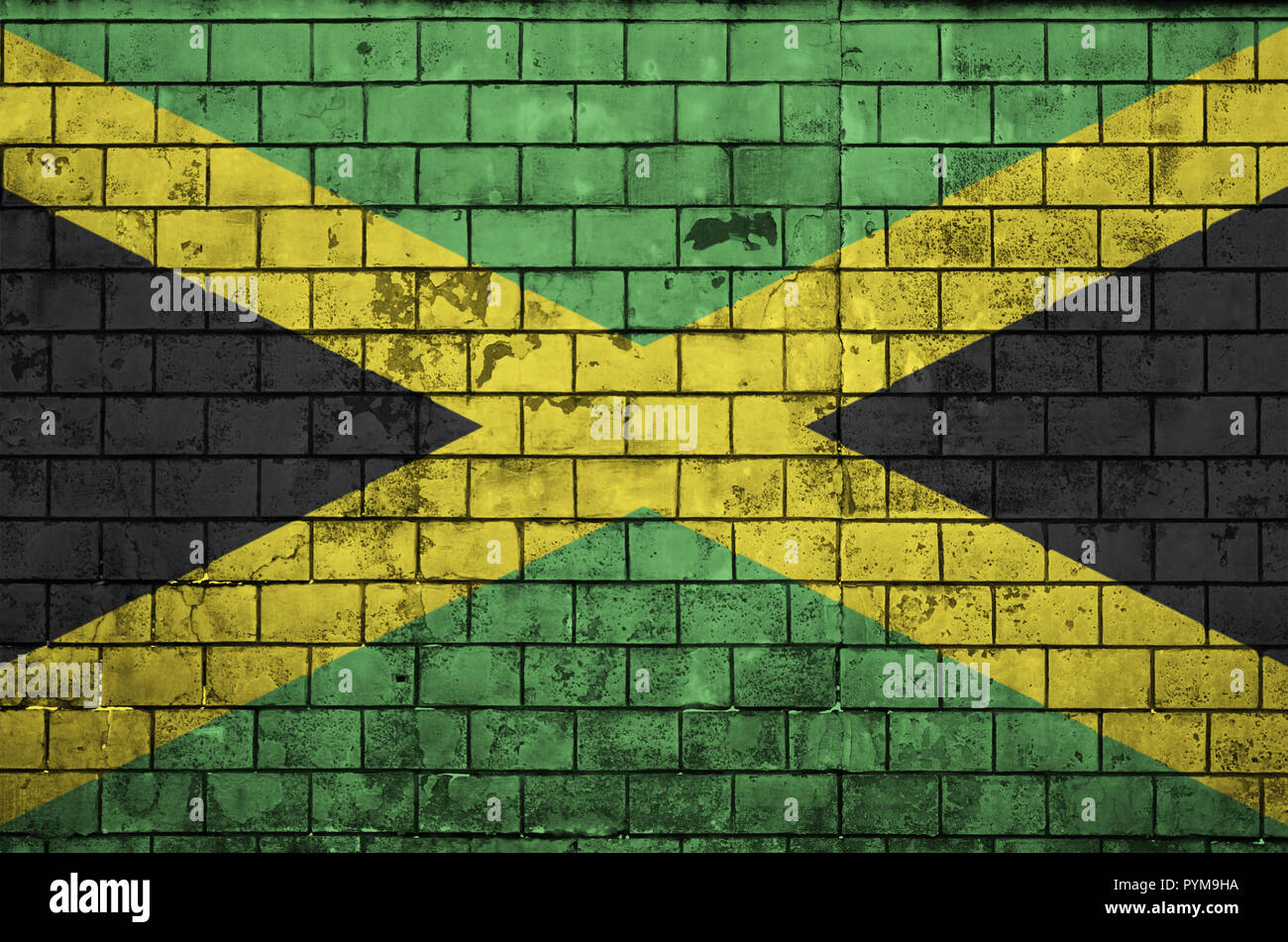 Jamaica flag is painted onto an old brick wall Stock Photo - Alamy