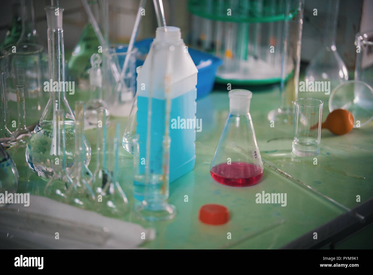 Table full of chemicals and flasks. Chemical lab Stock Photo - Alamy