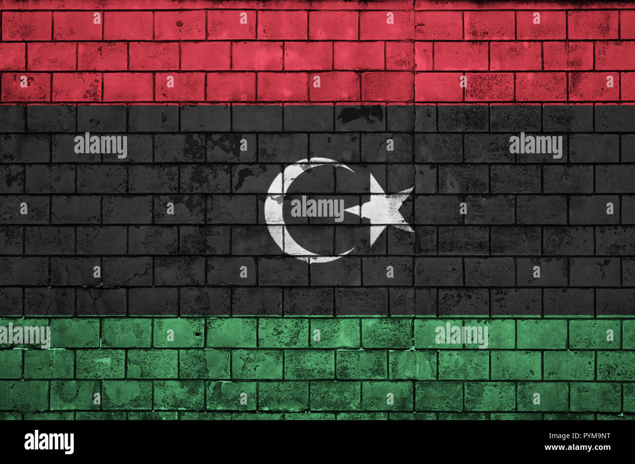 Libya flag is painted onto an old brick wall Stock Photo - Alamy