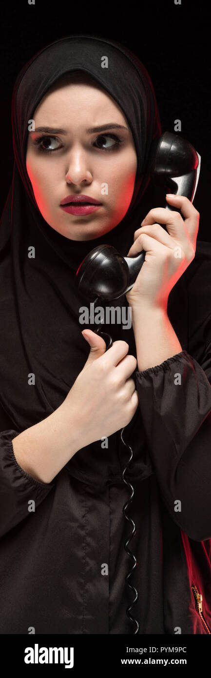 Portrait of beautiful serious scared frightened young muslim woman ...