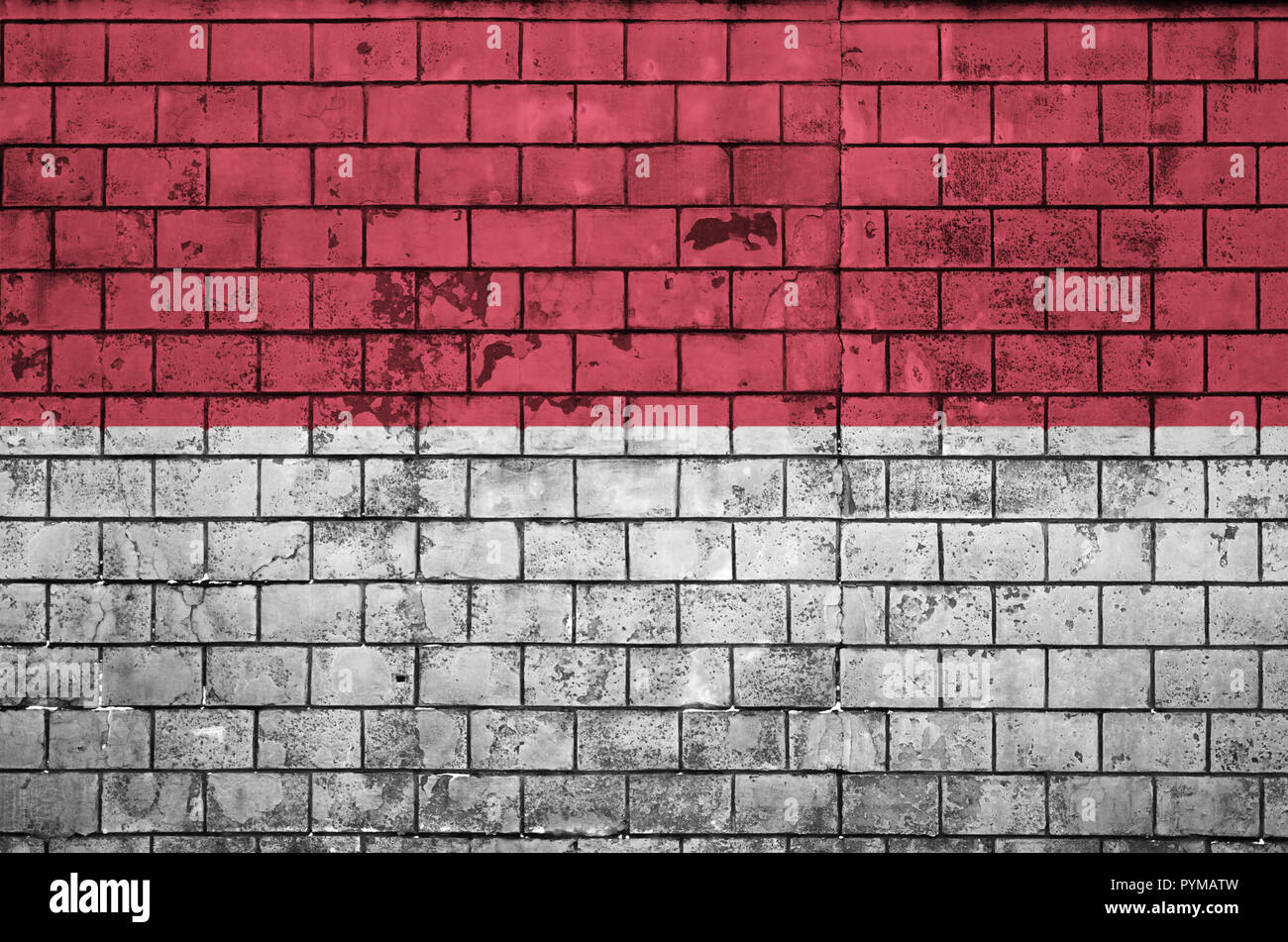 Monaco flag is painted onto an old brick wall Stock Photo - Alamy
