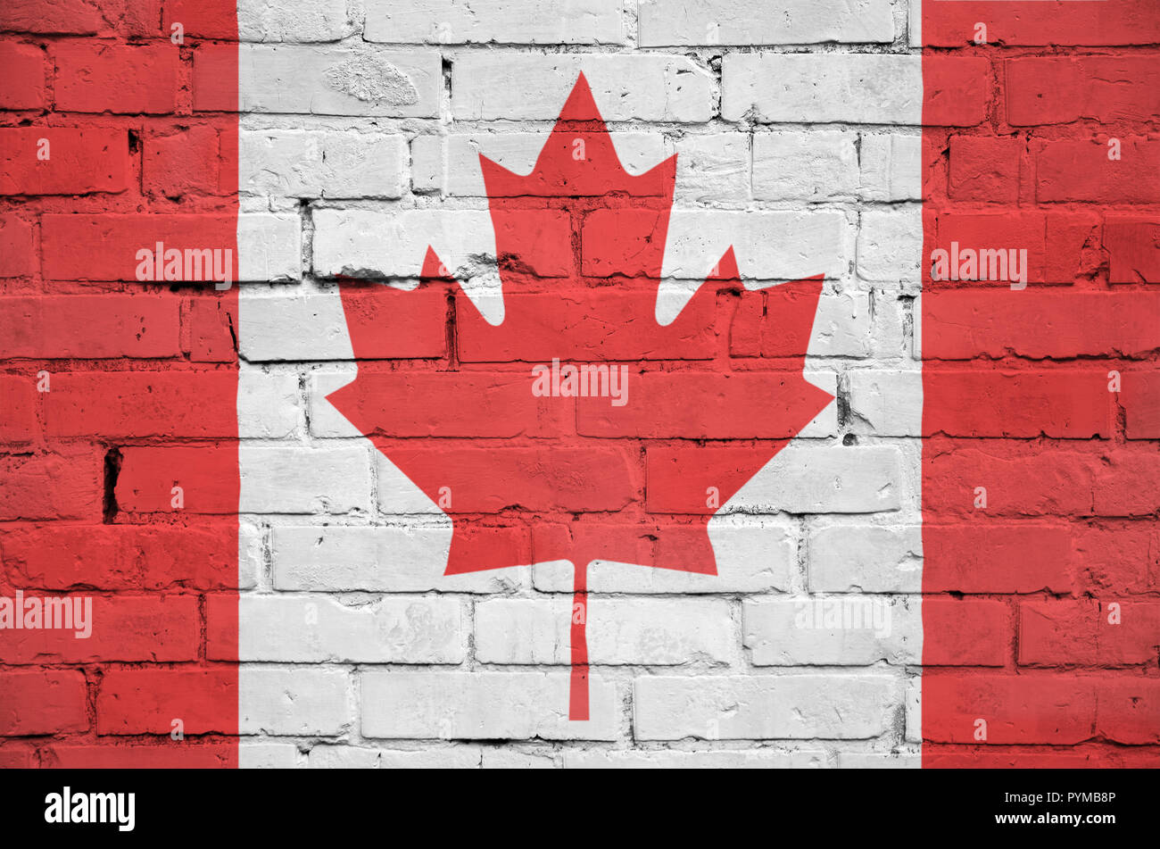 Canada flag is painted onto an old brick wall Stock Photo - Alamy