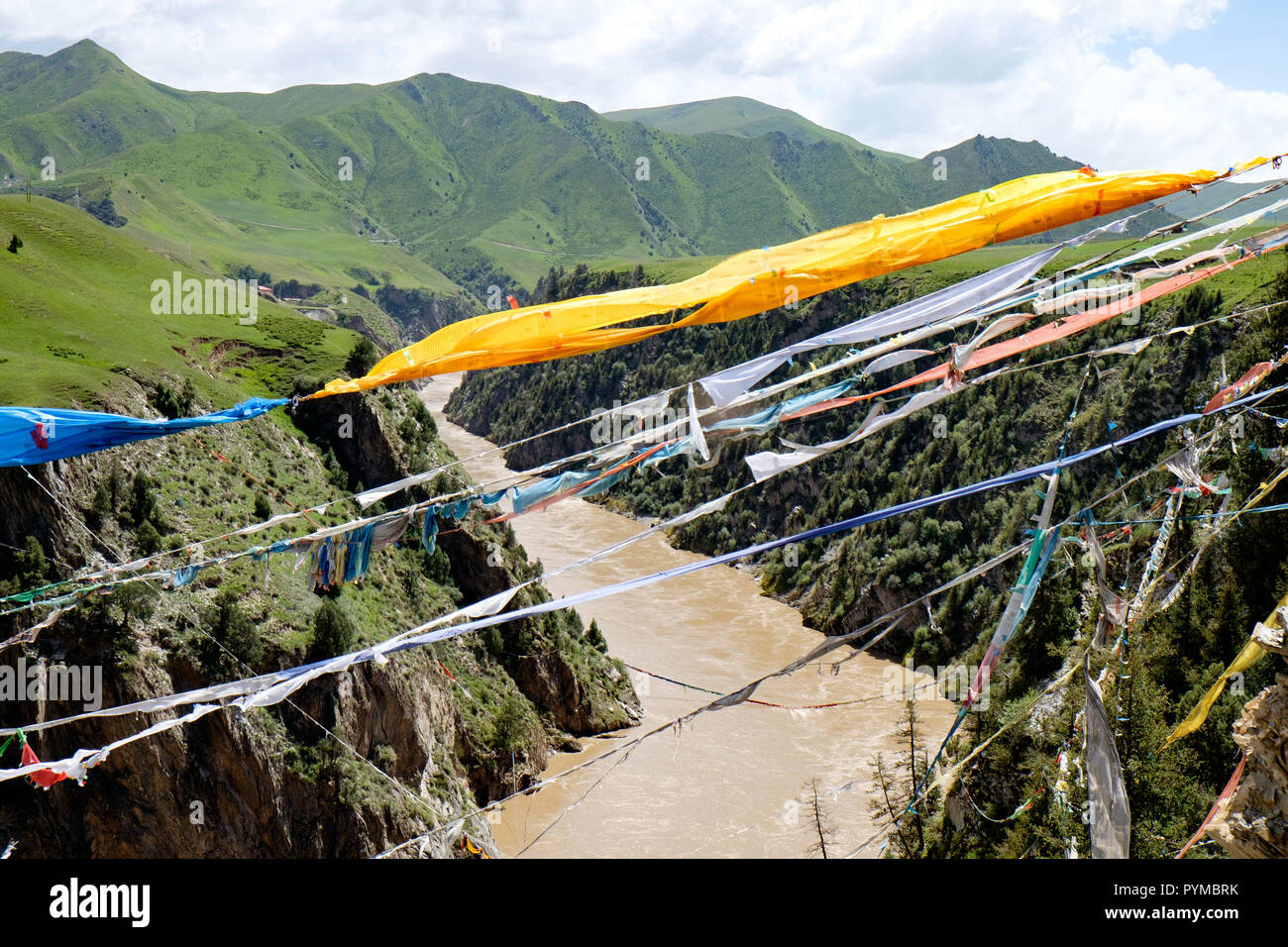 Prayer flags over the Yellow River in Henan Mongol Autonomous County ...