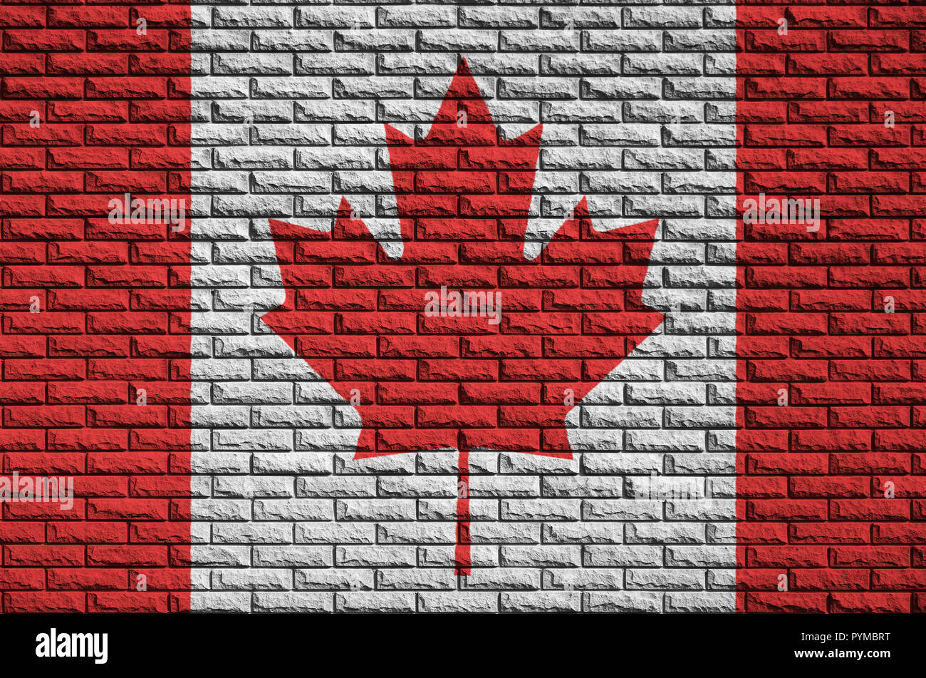 Canada flag is painted onto an old brick wall Stock Photo - Alamy