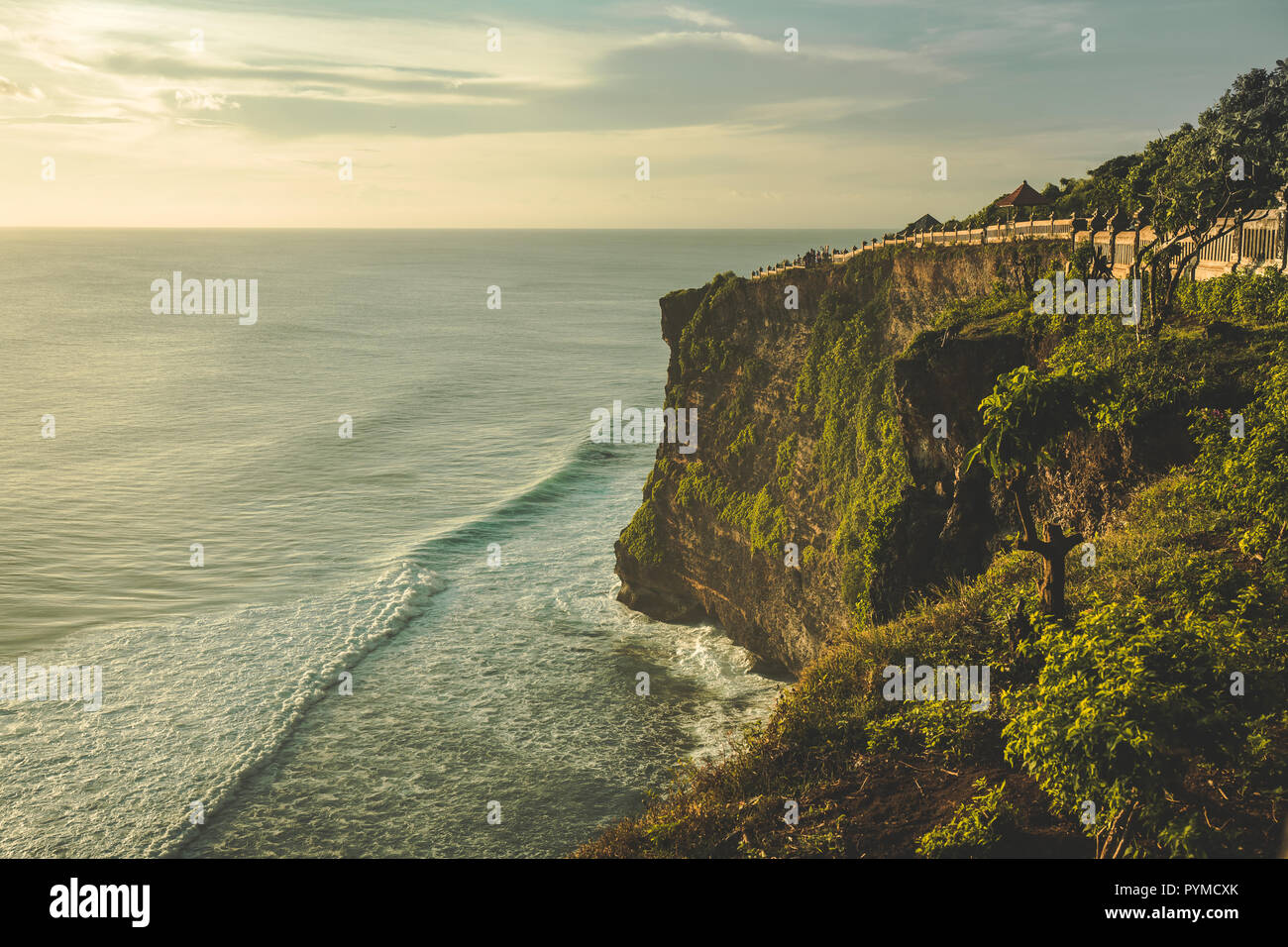 Cliff, ocean shore, tourist path. Panorama. Uluwatu. Bali island ...