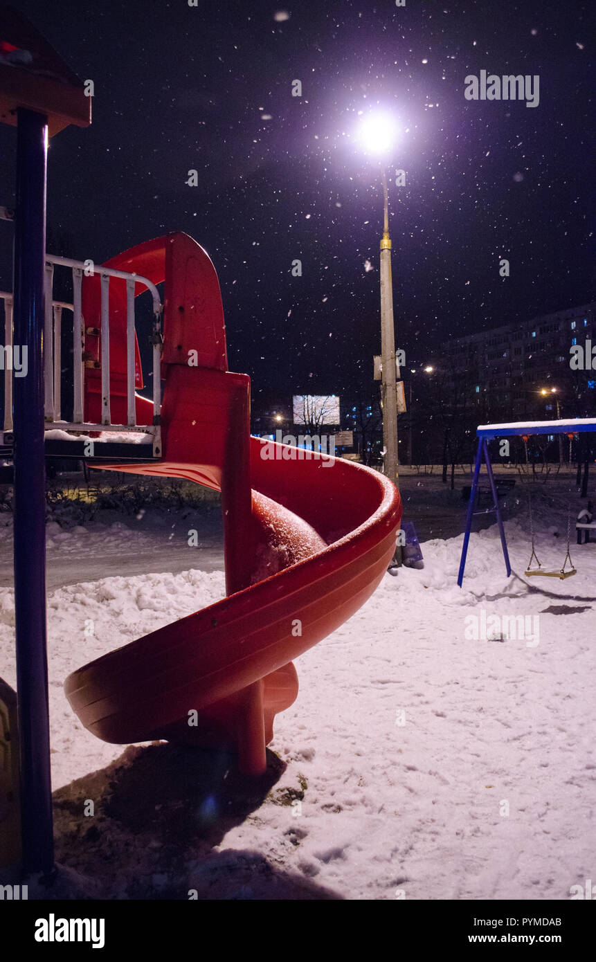 Snow-covered playground at night in the city in winter Stock Photo - Alamy