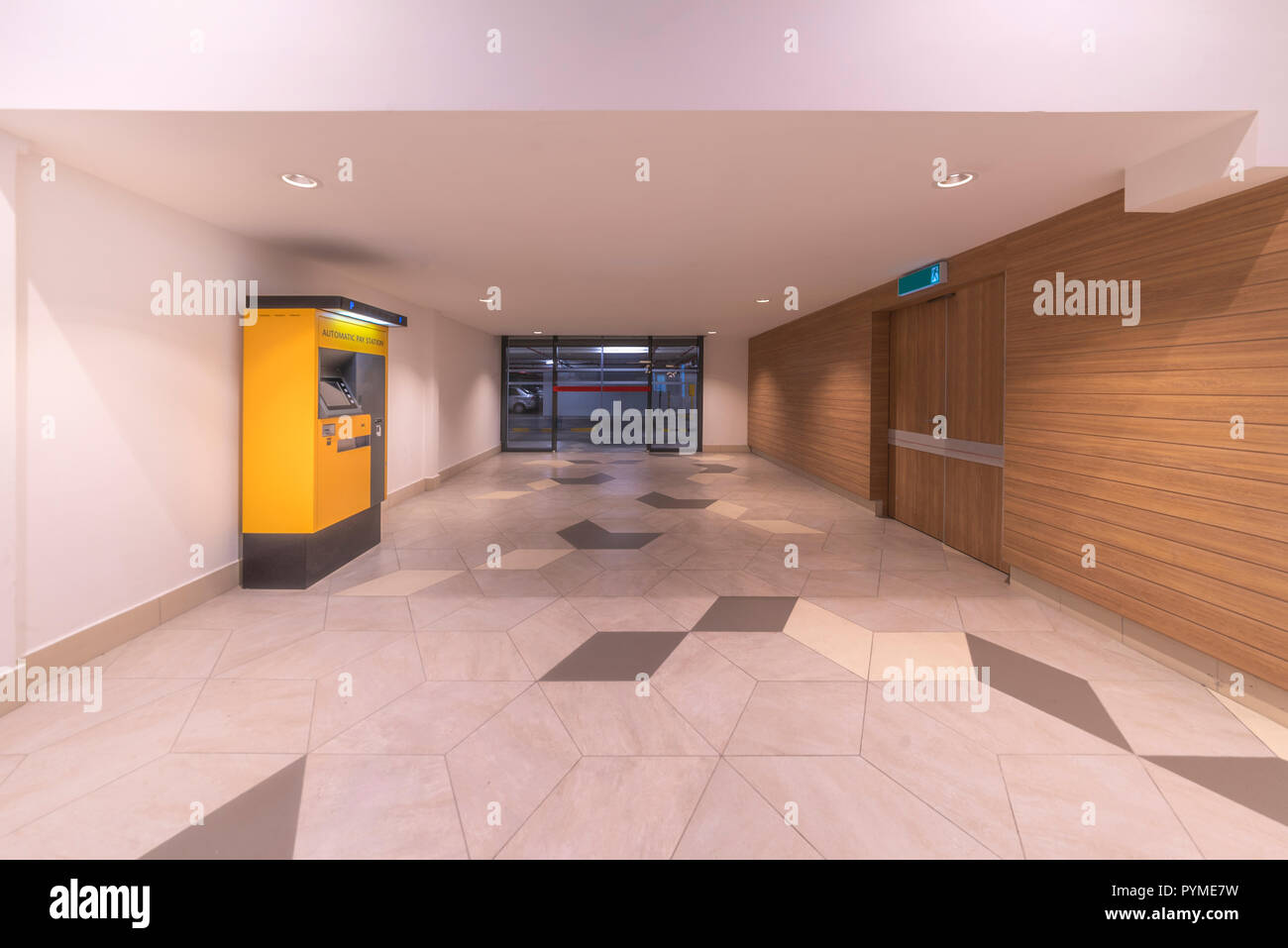 Automatic car park payment machine standing in the exit corridor ...