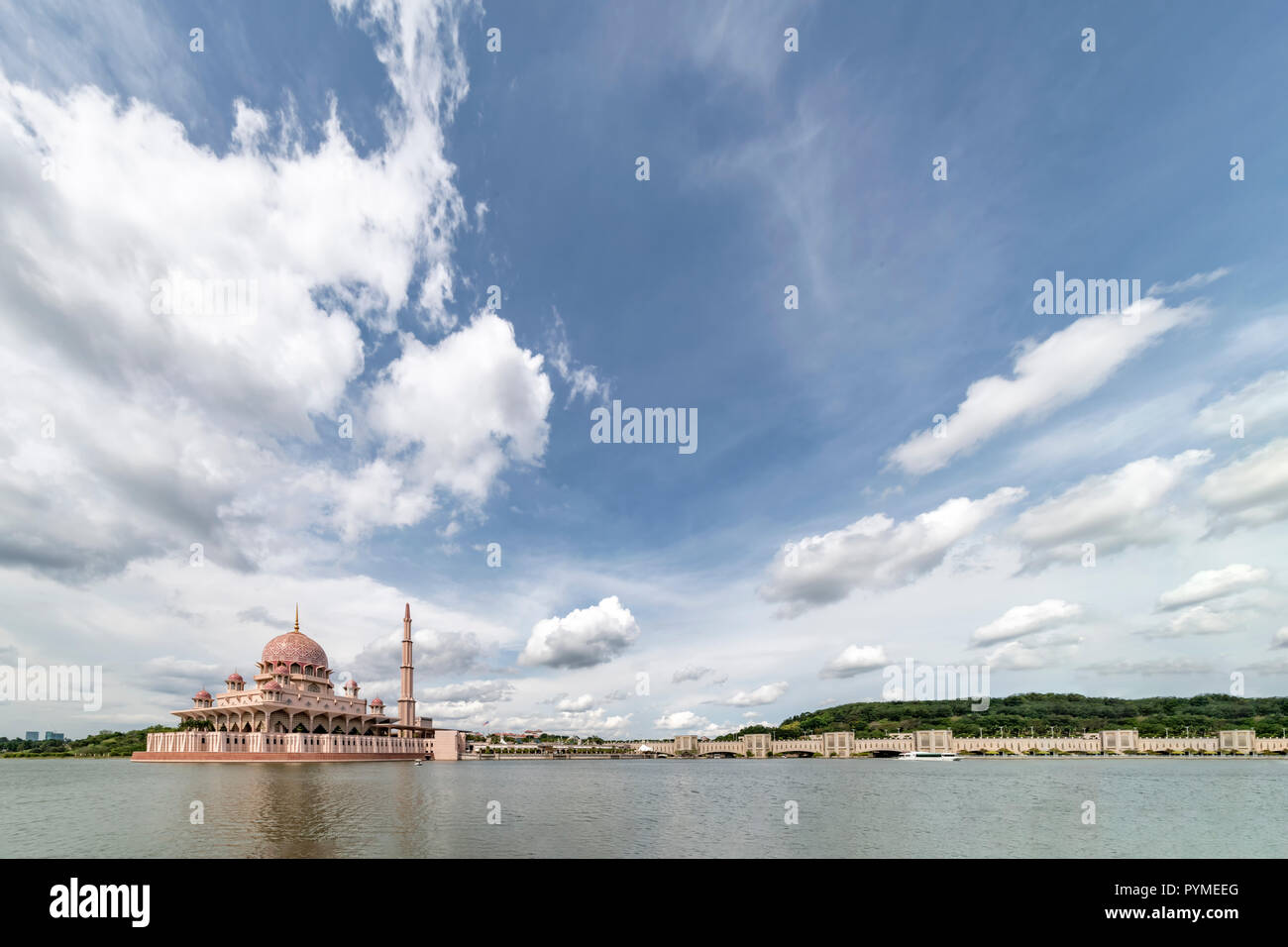 Pink color Putrajaya mosque surrounded by water at Putra Jaya city, the ...