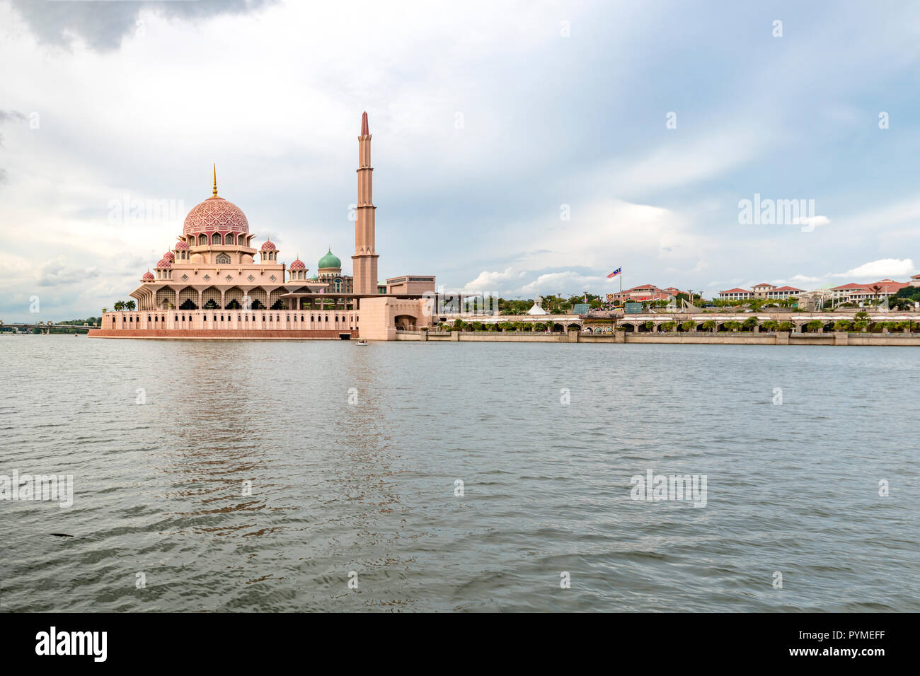 Pink color Putrajaya mosque surrounded by water at Putra Jaya city, the ...