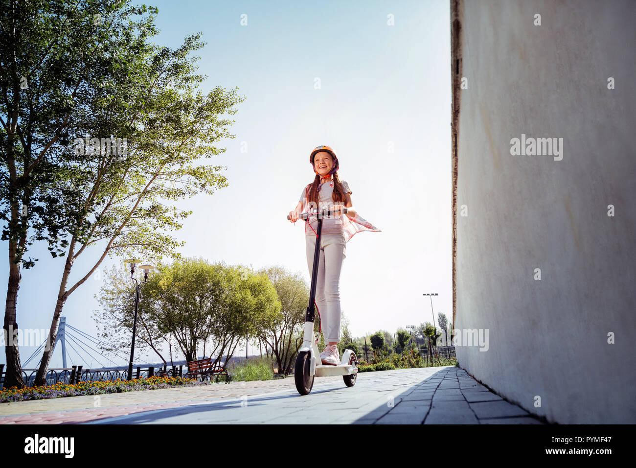 Positive delighted child enjoying her active weekends Stock Photo - Alamy