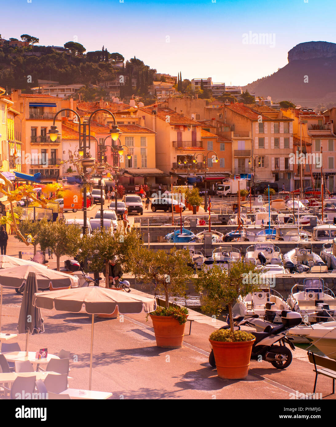 Chateau de Cassis castle on top of hill and close up of boats moored in ...