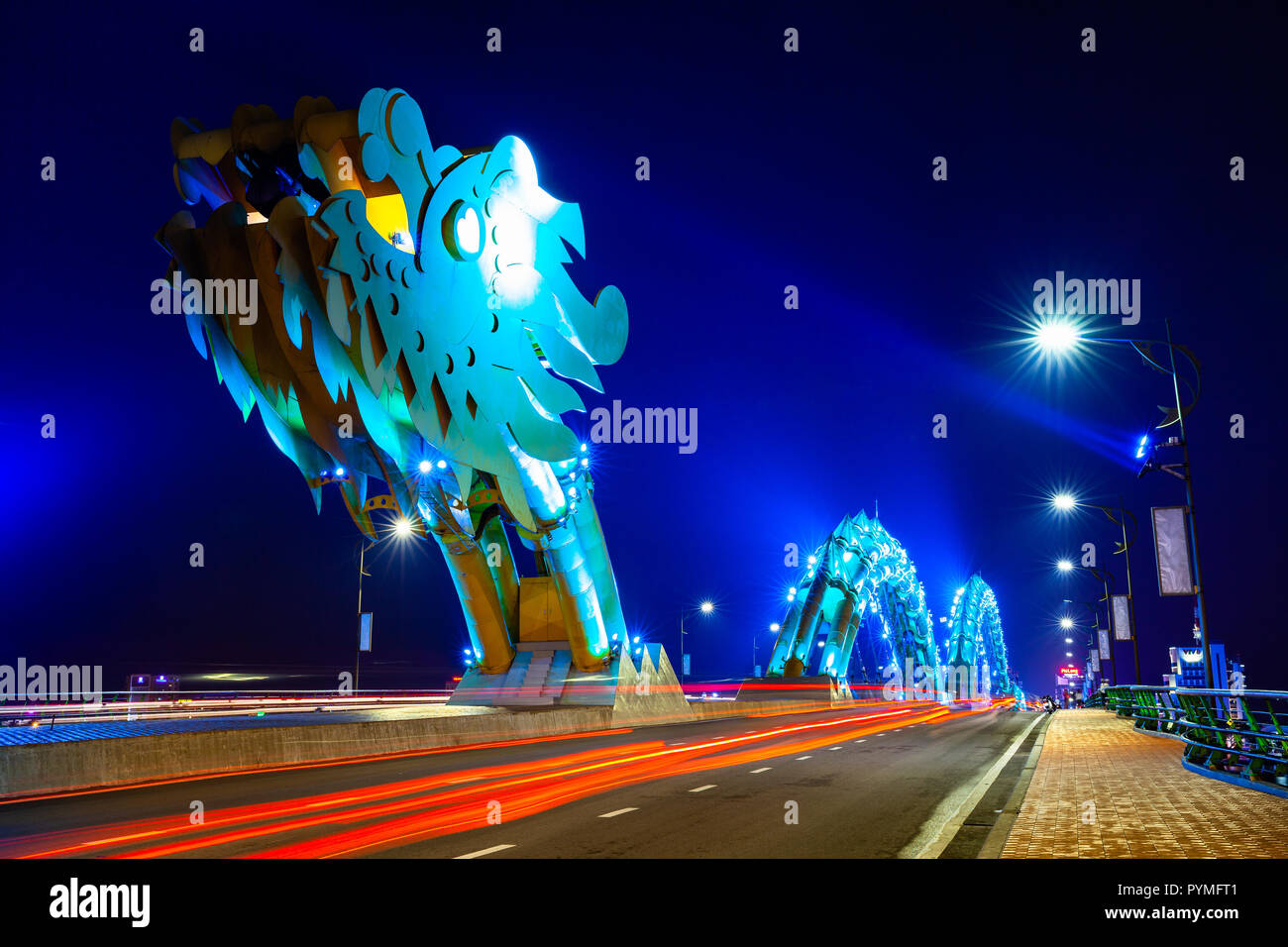 The Dragon Bridge (Cau Rong) with blue-colored illumination at night ...