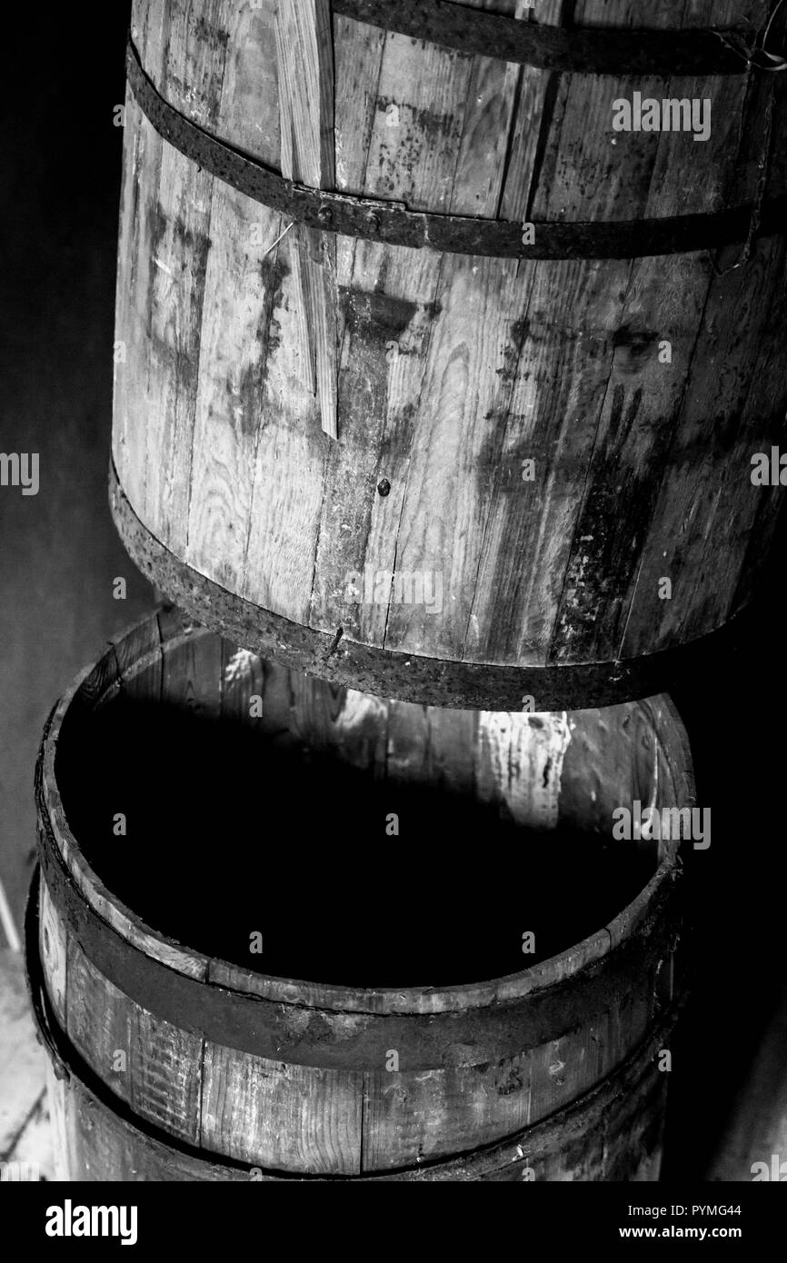 Rustic old oak wooden barrels in an old Swedish farm in northern Sweden ...