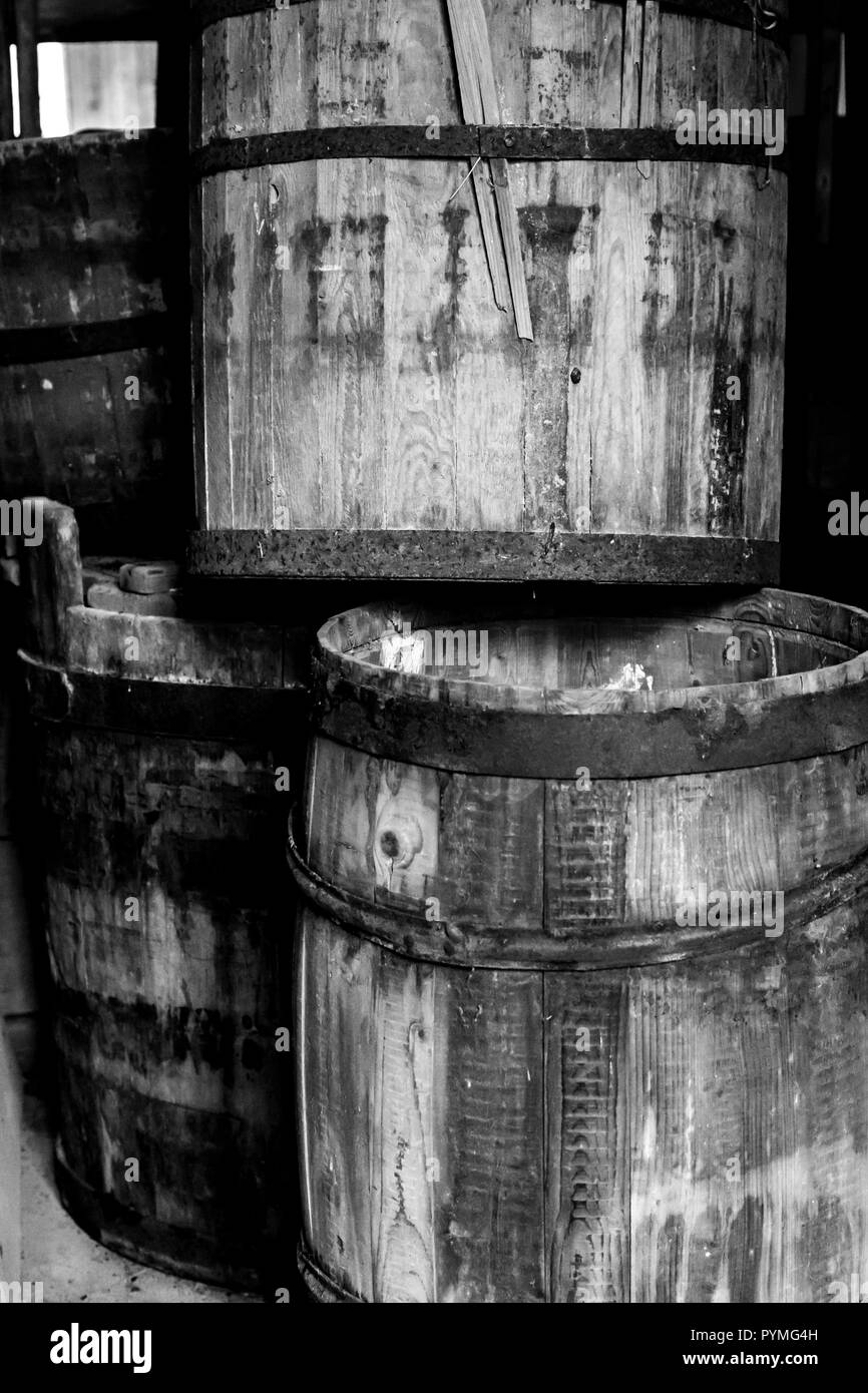 Rustic old oak wooden barrels in an old Swedish farm in northern Sweden ...