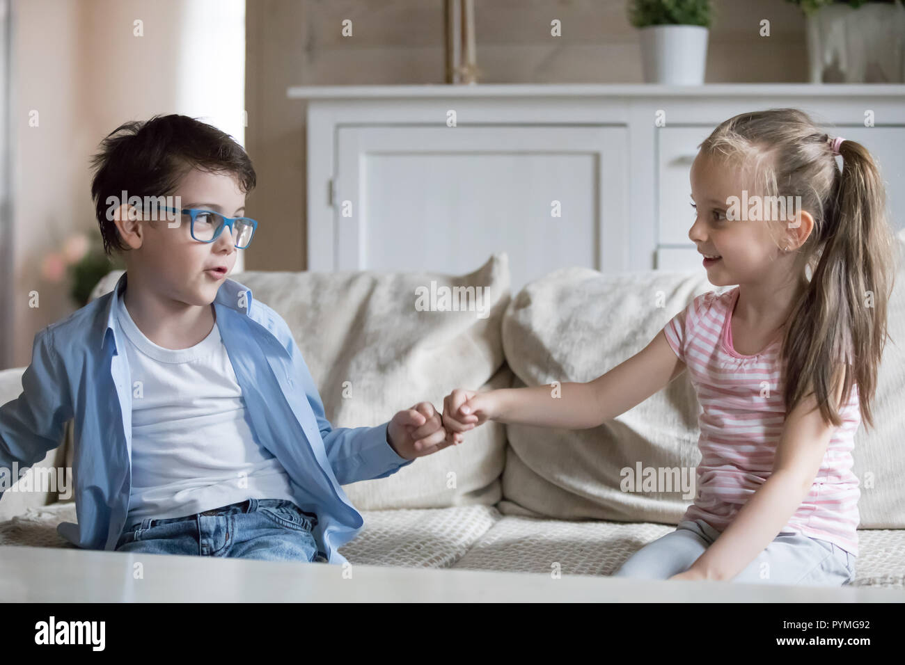 Children siblings hold hands hi-res stock photography and images - Alamy