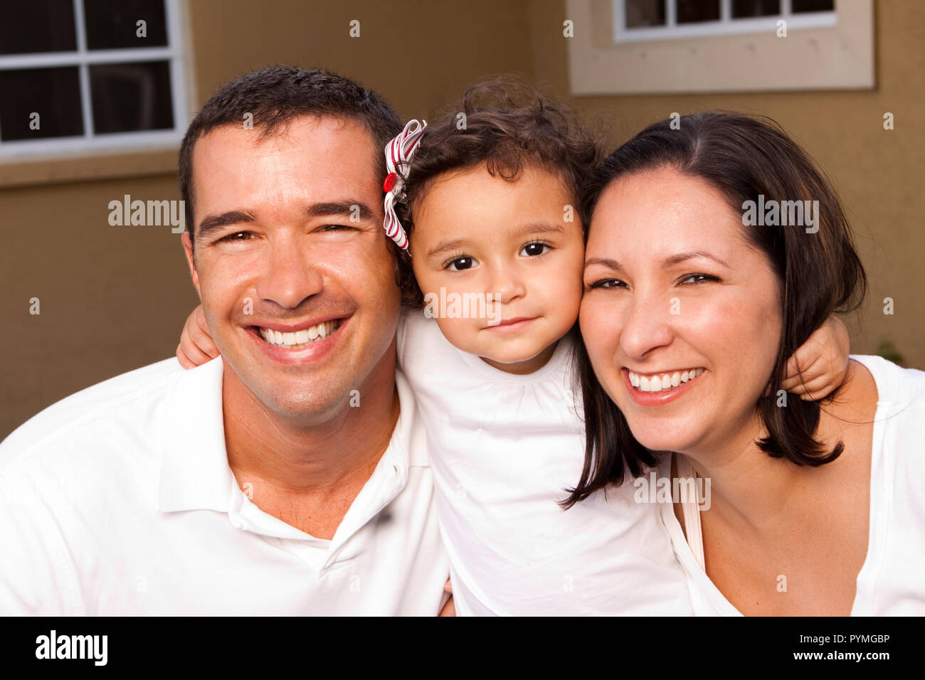 Happy Hispanic family smiling laughing Stock Photo - Alamy