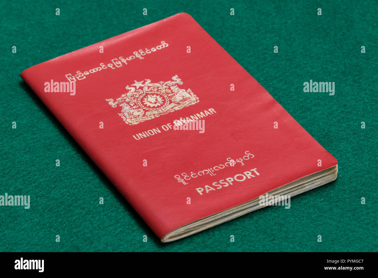 Myanmar Burmese passport on green table Stock Photo - Alamy