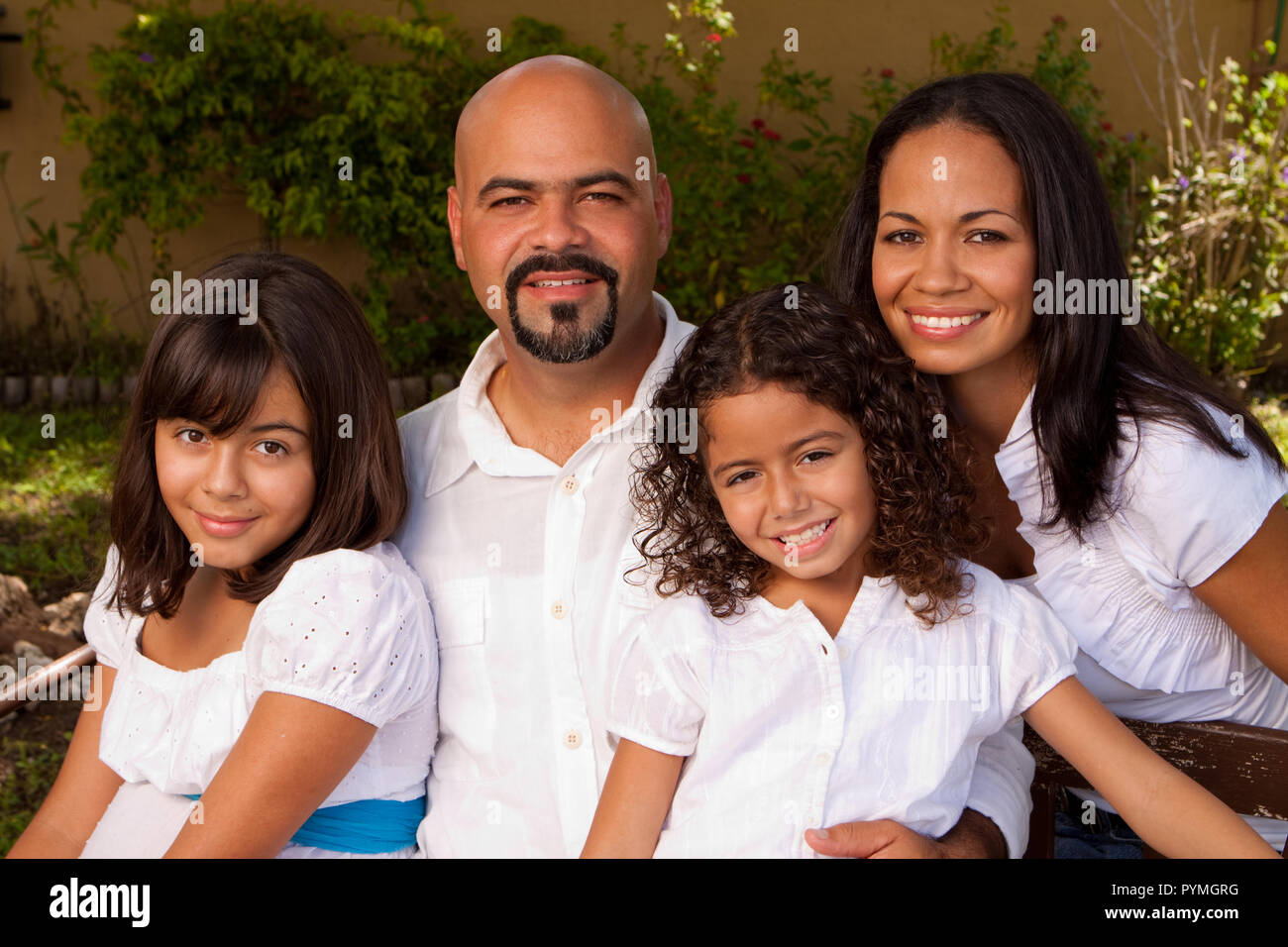 Happy Hispanic family smiling laughing Stock Photo - Alamy