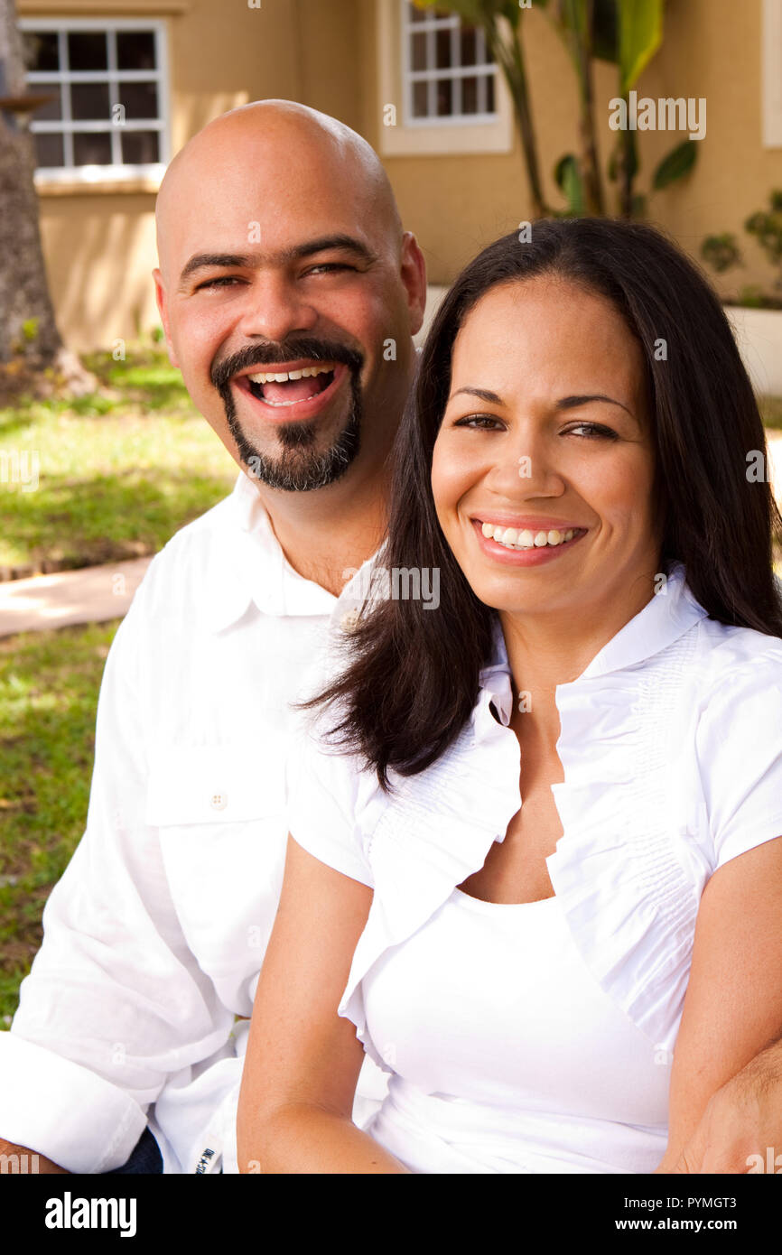 Hispanic couple laughing and smiling Stock Photo - Alamy