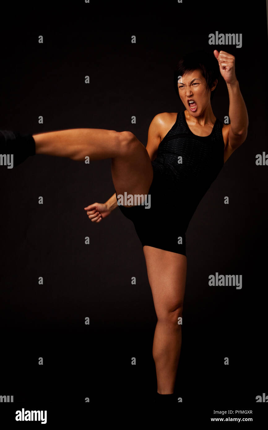 Asian woman kick boxing hi-res stock photography and images - Alamy