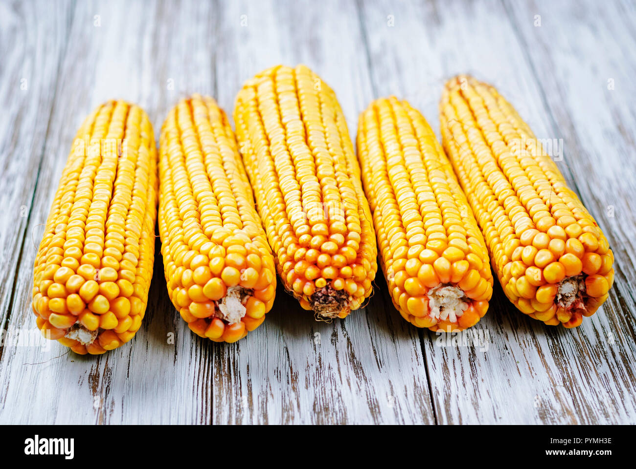 Raw corn shakes Stock Photo - Alamy