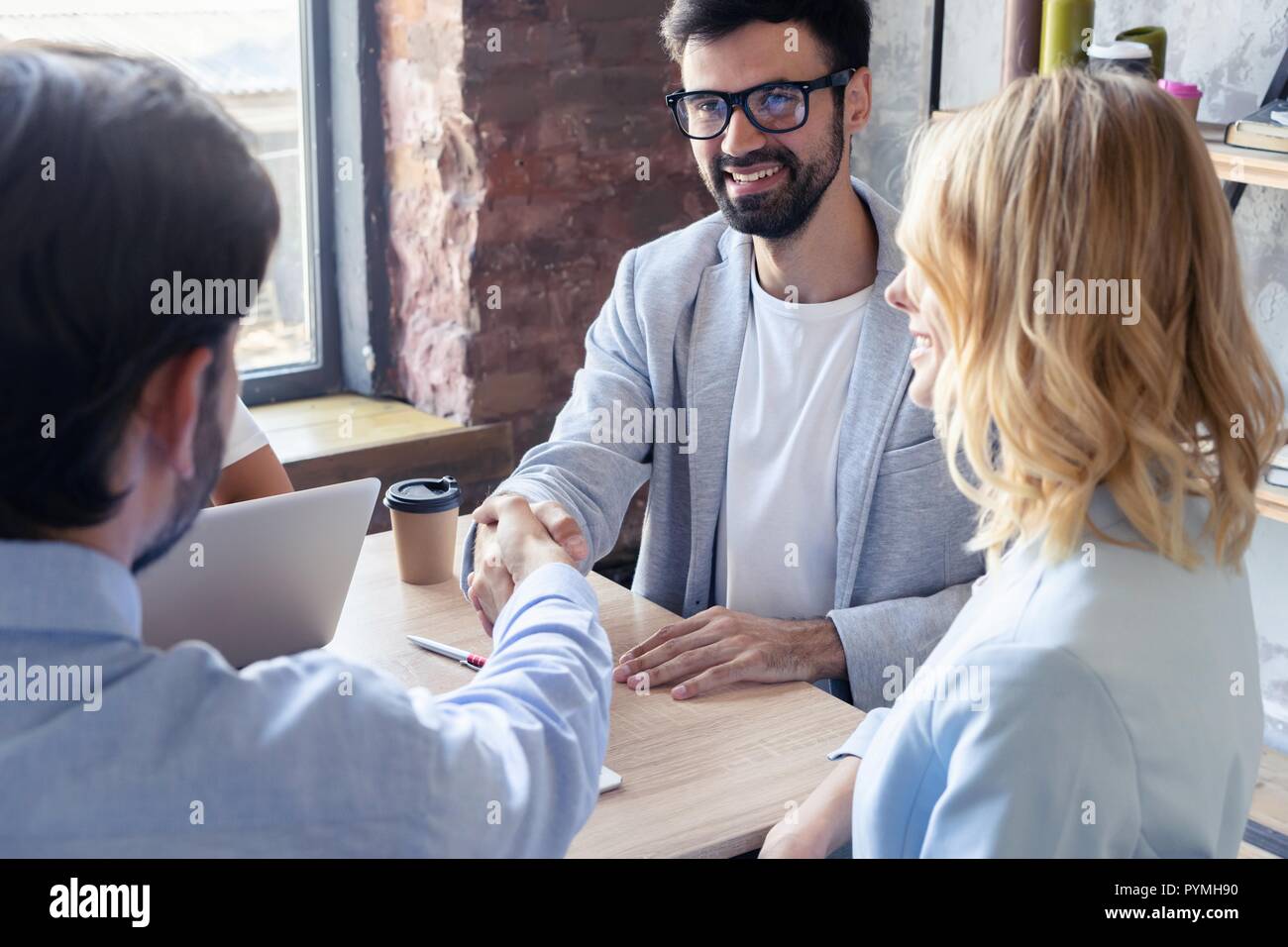 New business partners. Young modern colleagues in smart casual wear ...