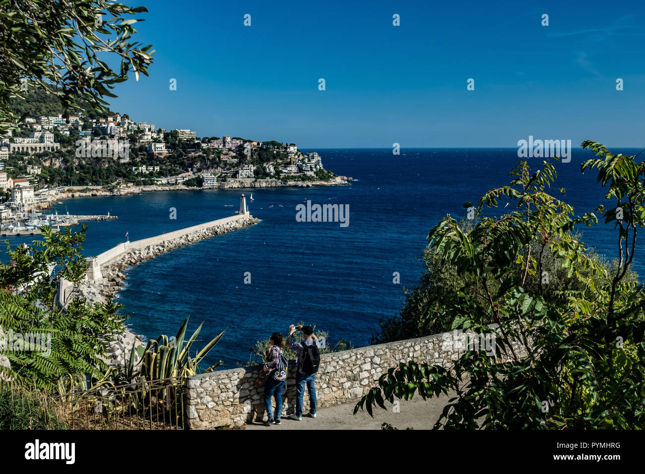 Tourists overlooking lighthouse bay Nice Cote D´azur France Stock Photo ...