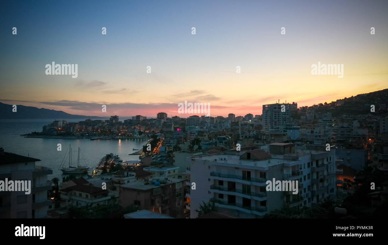 night Aerial Panoramic view to Saranda city and bay of Ionian sea in ...