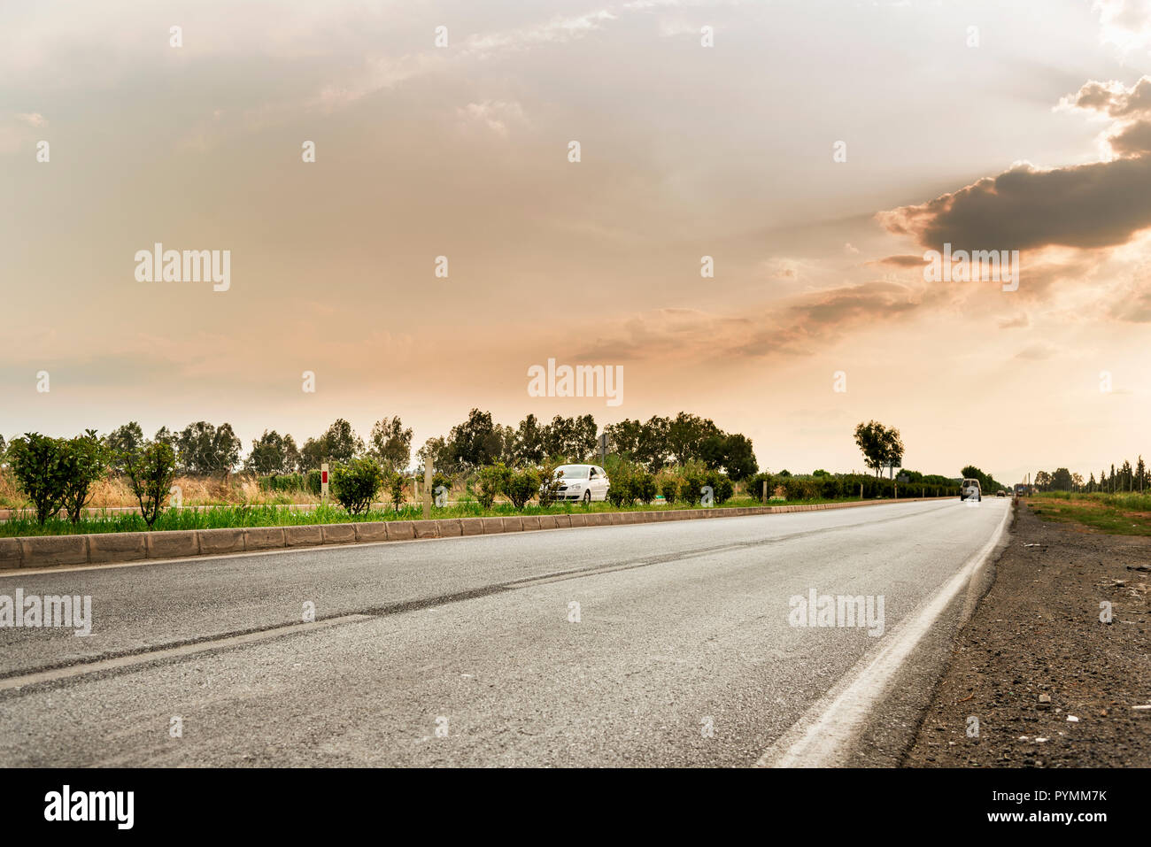 Empty road with a beautiful sky in the evening Stock Photo - Alamy