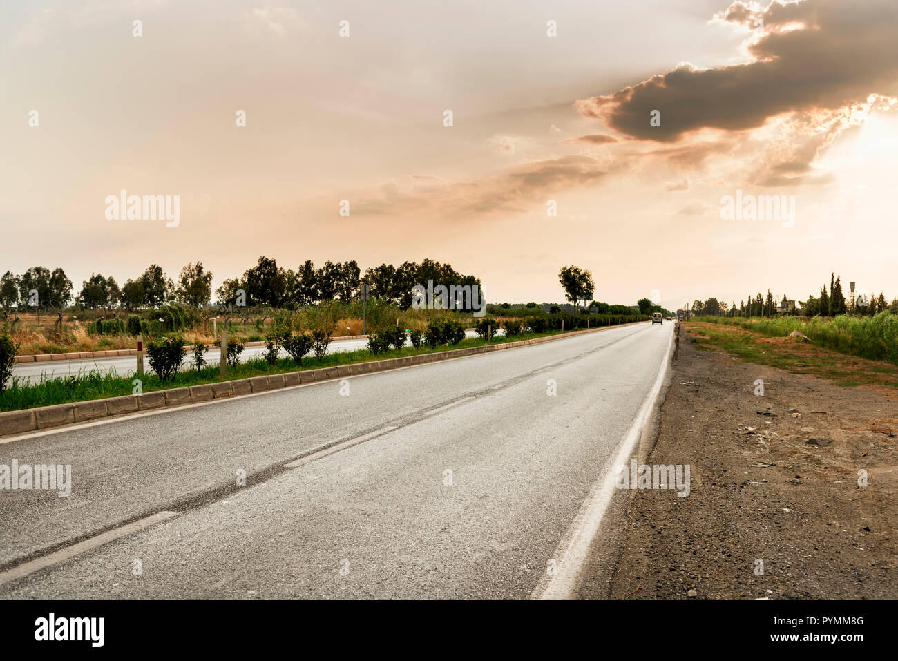 Empty road with a beautiful sky in the evening Stock Photo - Alamy