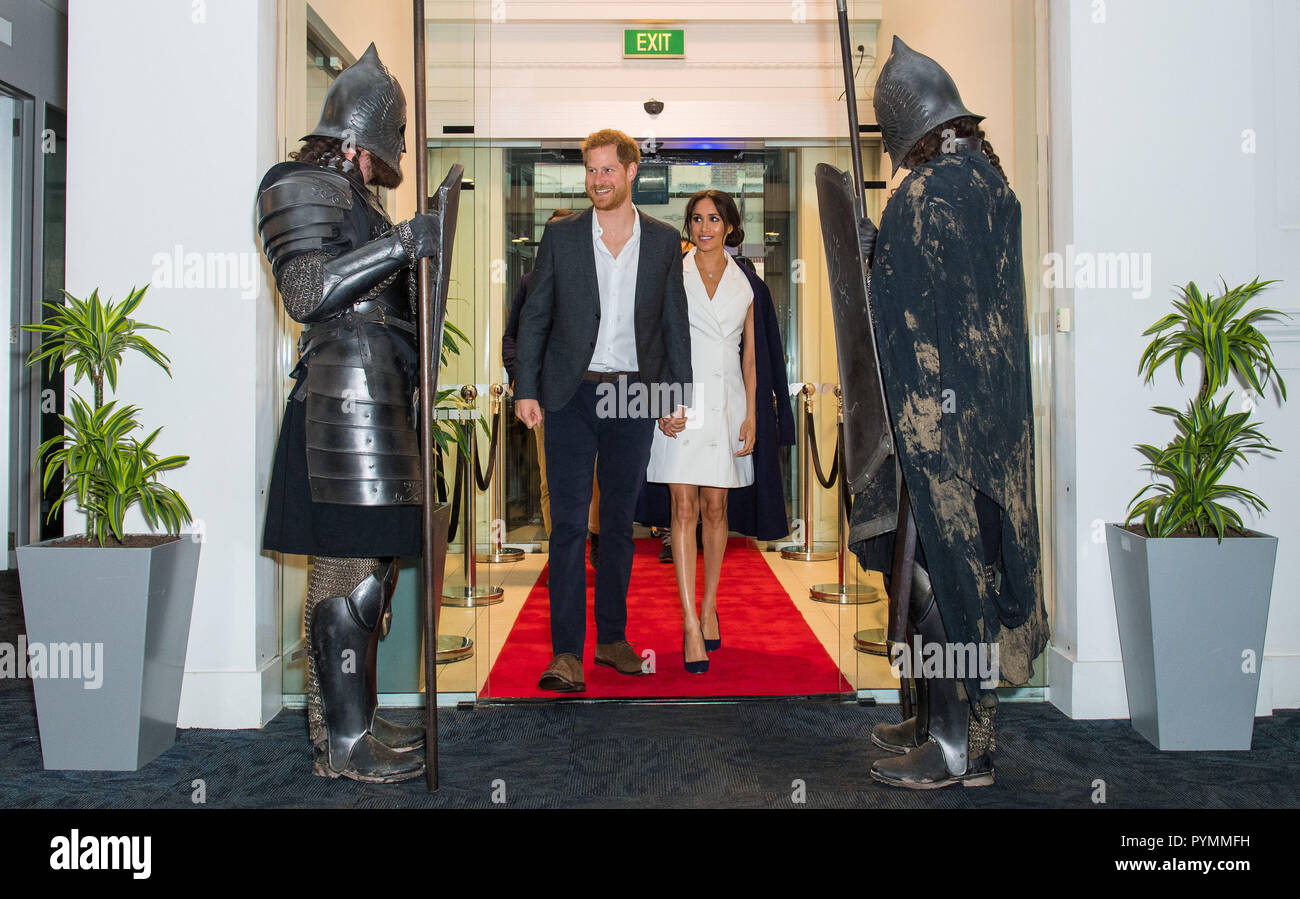 The Duke and Duchess of Sussex are greeted by actors in costume as they ...